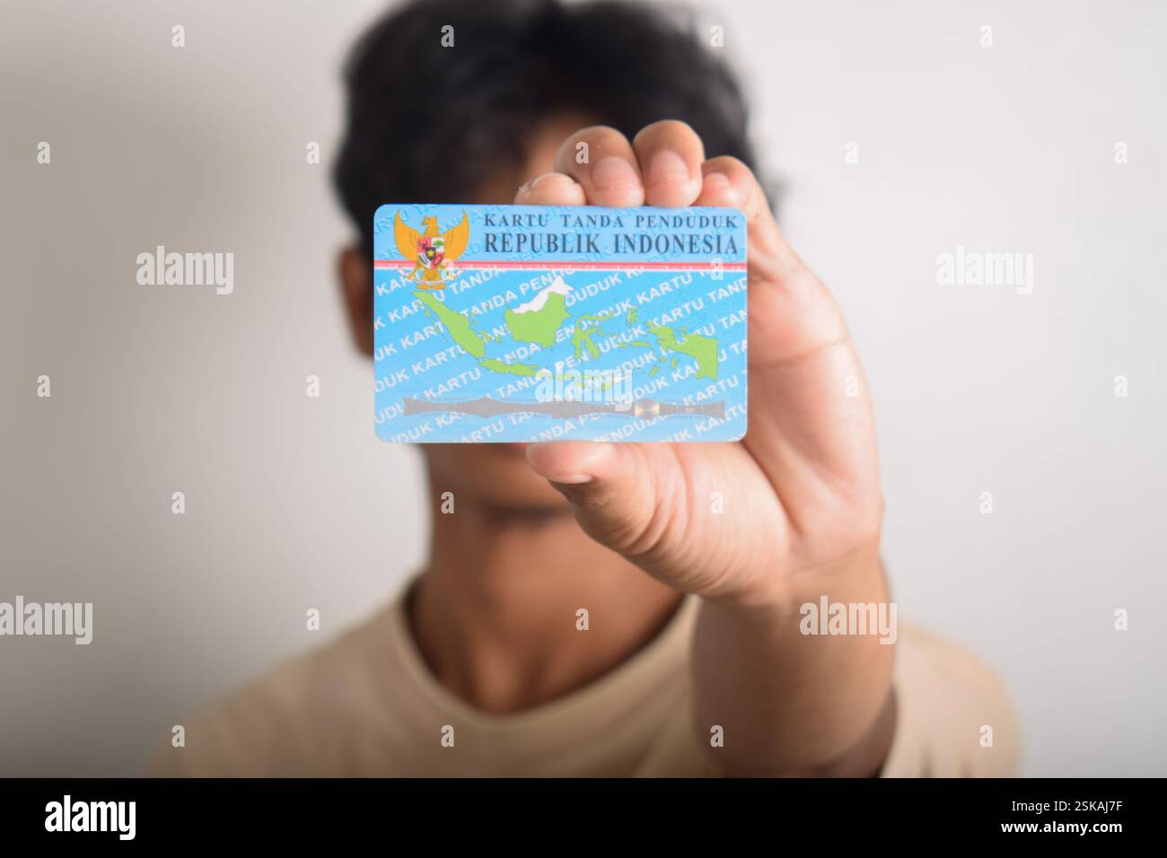 Pasuruan, Indonesia - February 9, 2025: Man holding KTP Kartu Tanda ...