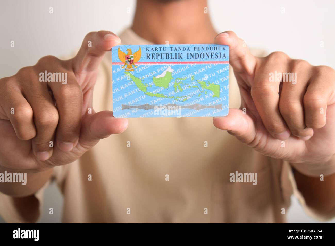 Pasuruan, Indonesia - February 9, 2025: Man holding KTP Kartu Tanda ...