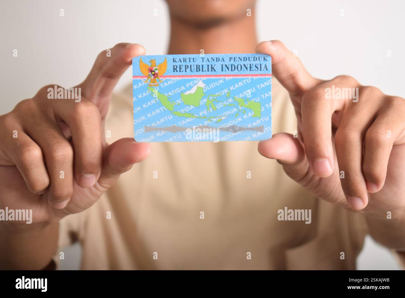 Pasuruan, Indonesia - February 9, 2025: Man holding KTP Kartu Tanda ...
