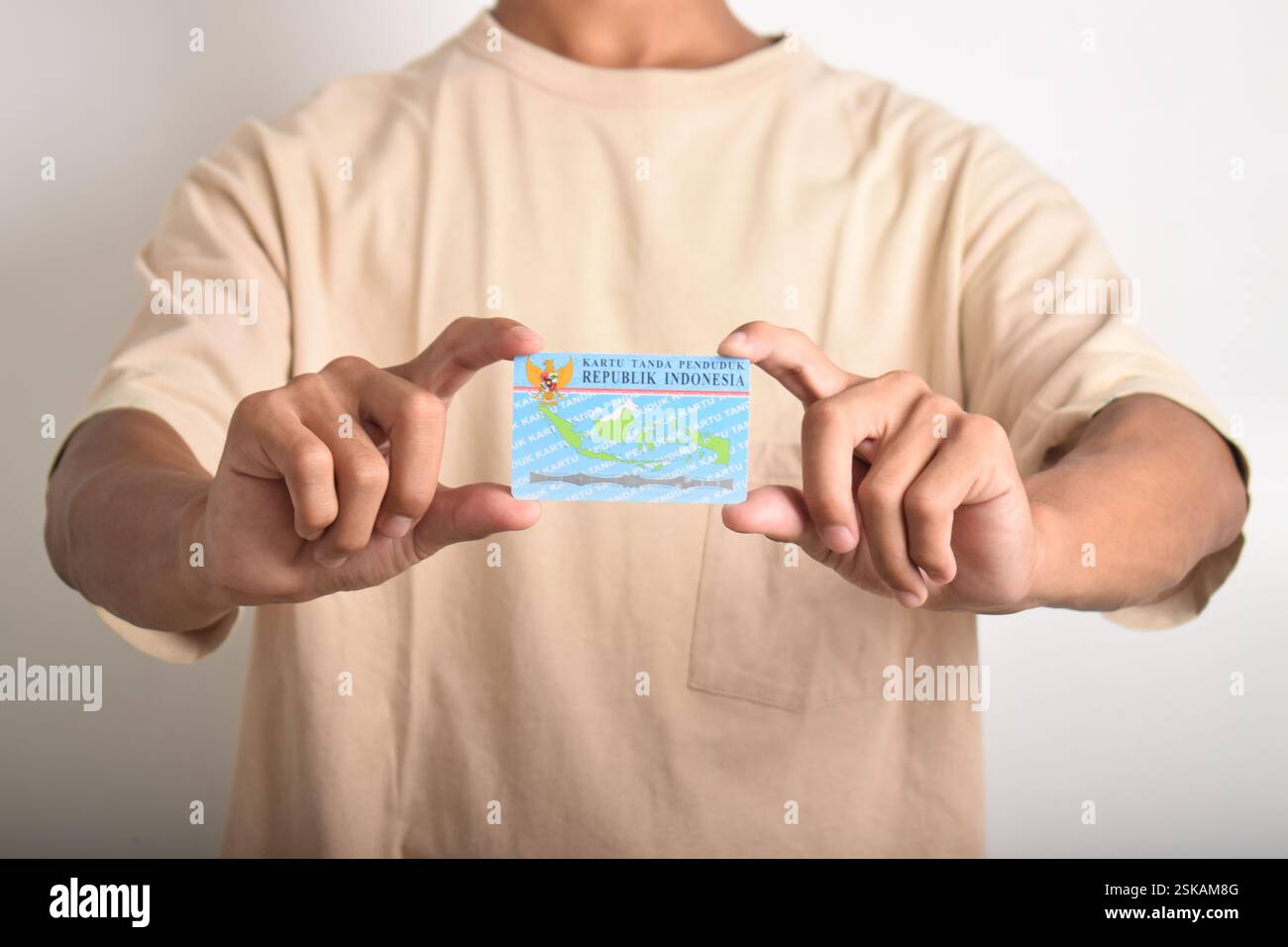 Pasuruan, Indonesia - February 9, 2025: Man holding KTP Kartu Tanda ...