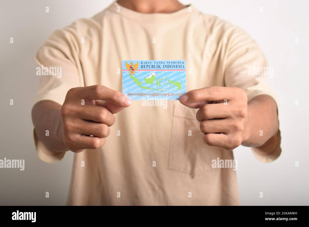 Pasuruan, Indonesia - February 9, 2025: Man holding KTP Kartu Tanda ...