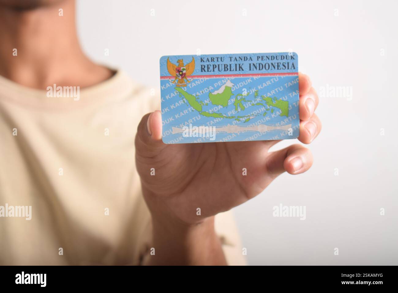 Pasuruan, Indonesia - February 9, 2025: Man holding KTP Kartu Tanda ...