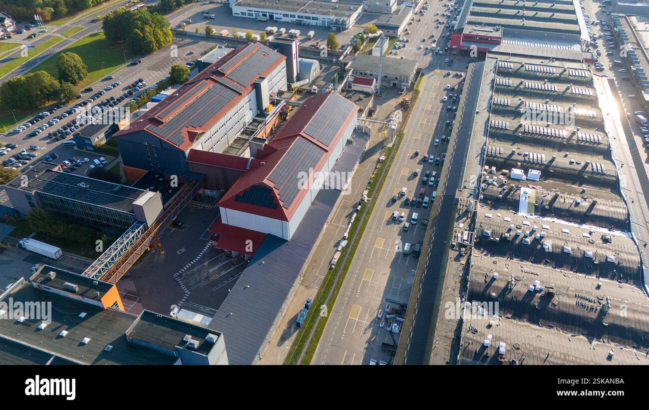 Aerial view of an industrial area with large warehouses and parking ...