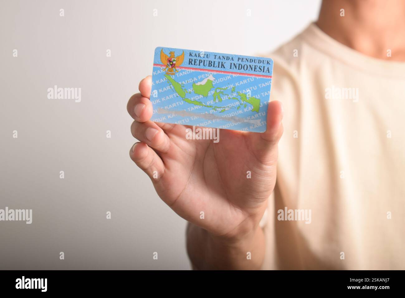 Pasuruan, Indonesia - February 9, 2025: Man holding KTP Kartu Tanda ...