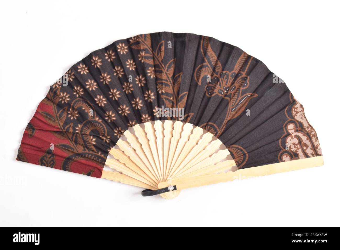 Traditional folding hand fan with batik motif isolated on white ...