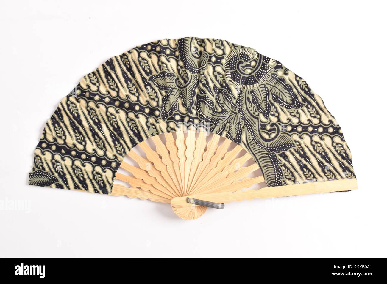 Traditional folding hand fan with batik motif isolated on white ...