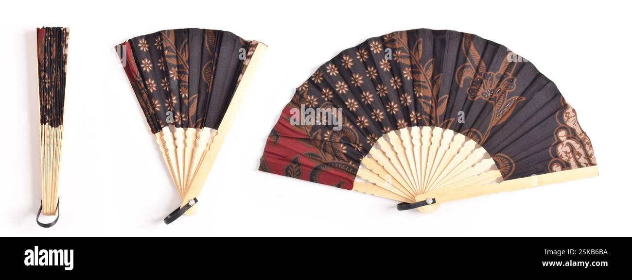 Traditional folding hand fan with batik motif isolated on white ...
