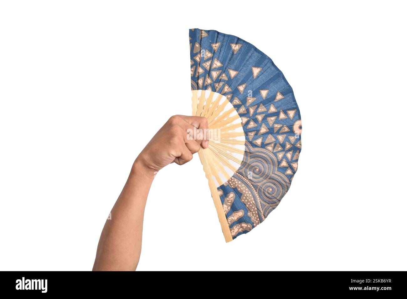 Hand holding Traditional folding hand fan with batik motif isolated on ...