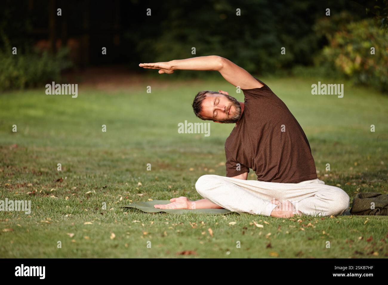 Yoga, stretching and relax with man in nature for parighasana pose ...