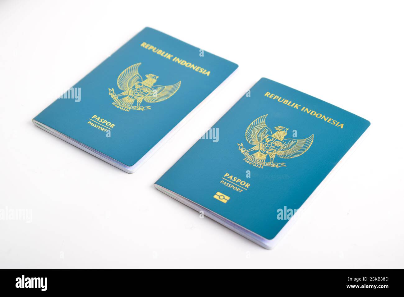 Indonesian electronic passport and regular passport isolated on white ...