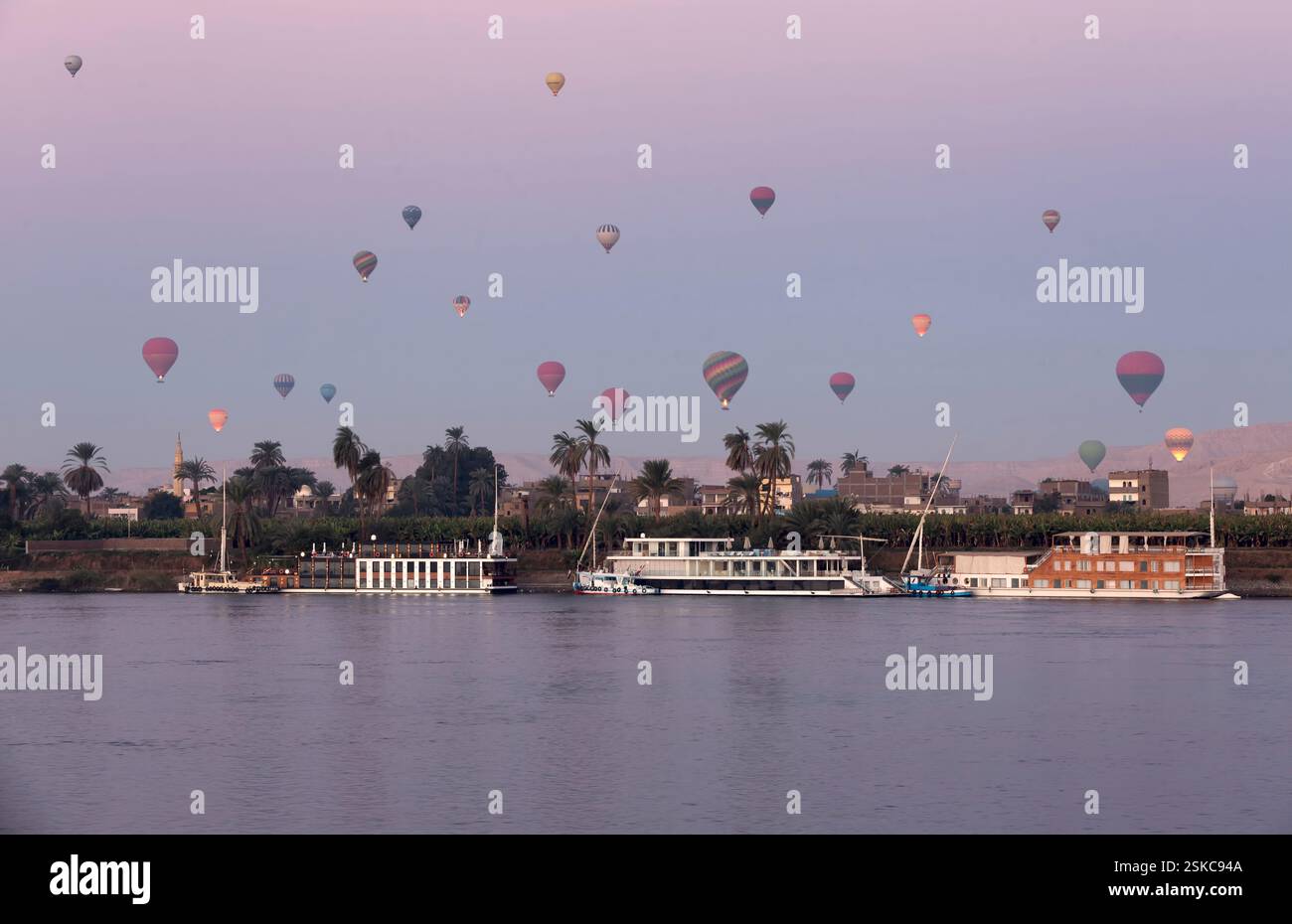 Hot air balloons over Nile river and Valley of Kings in Luxor at sunrise in Egypt Stock Photo ...