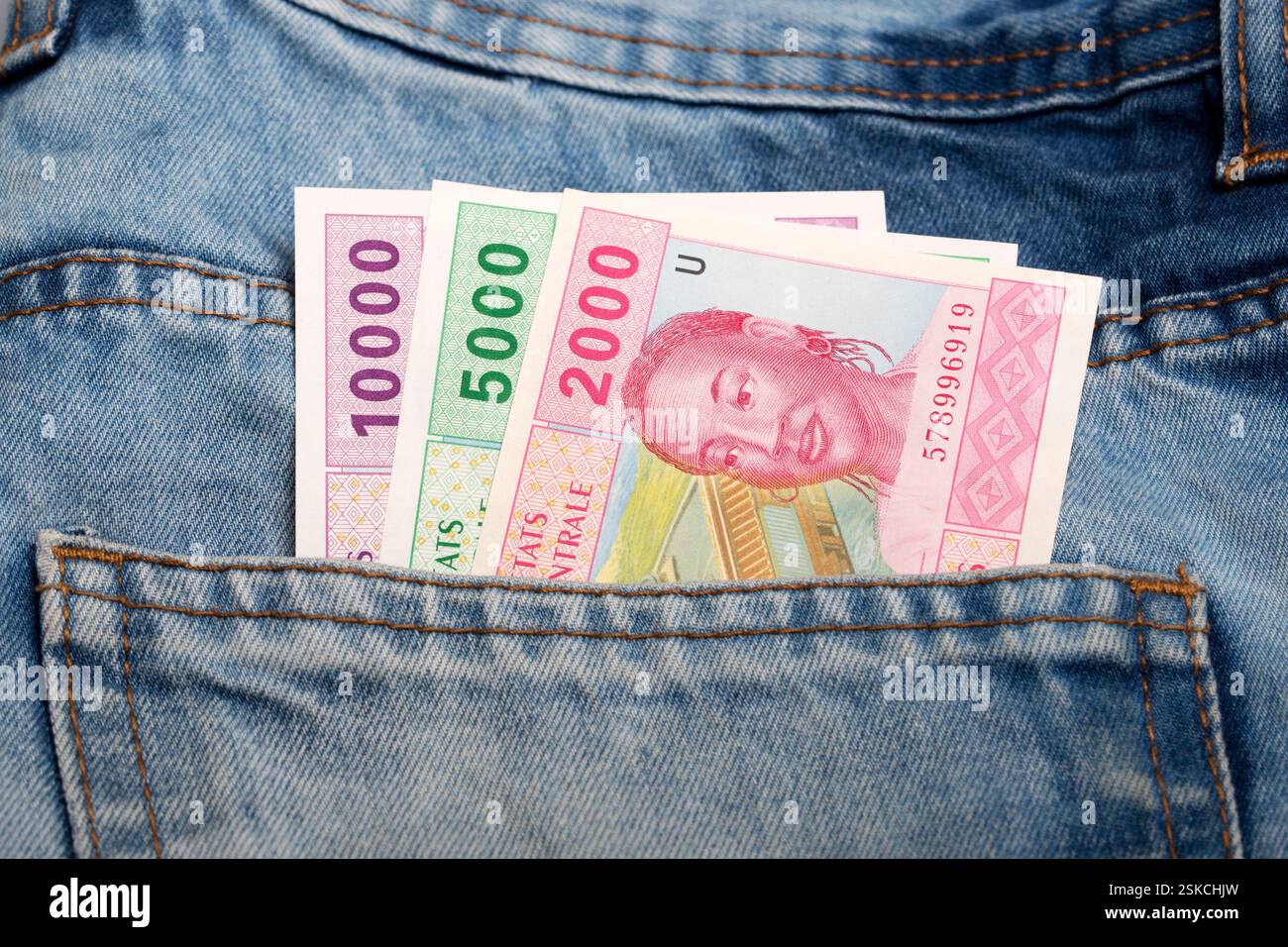 Old Central African CFA money - franc in the pocket of blue jeans Stock ...