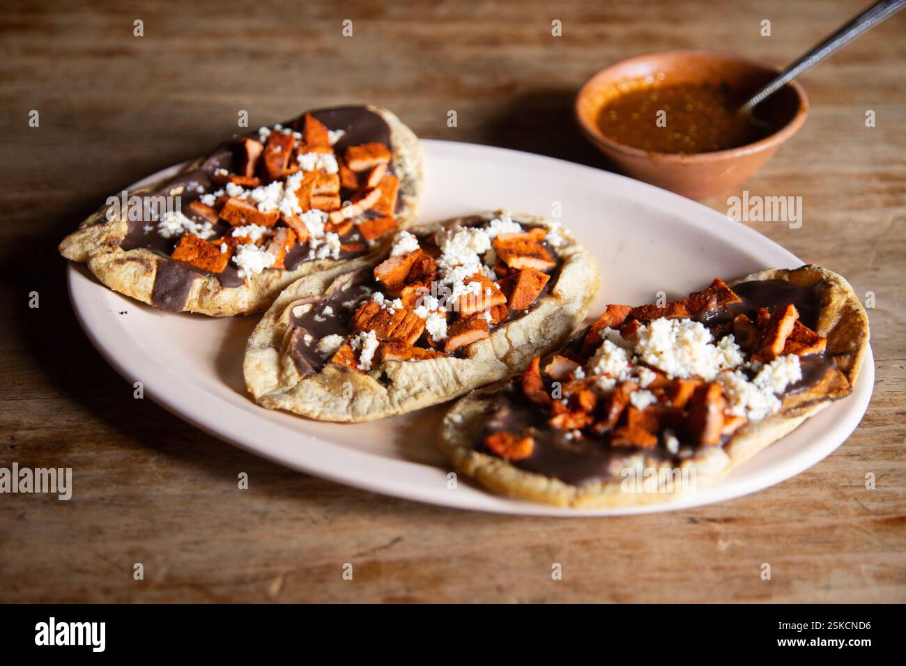 Memelas with beef jerky. Memela is an oval tortilla, made of corn dough ...