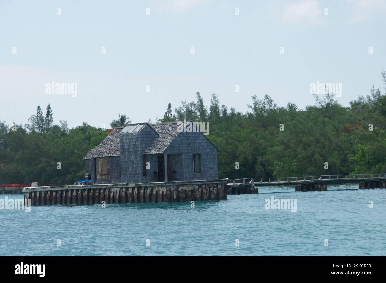 Beachfront bungalow in the Bahamas. Rustic wooden structure on stilts ...