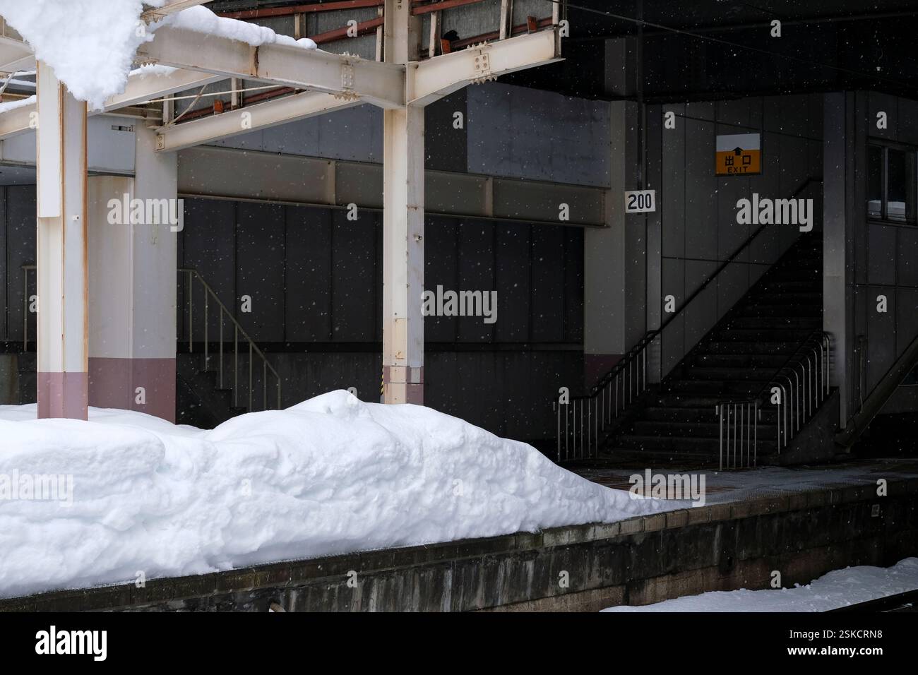 Snow-covered train platform at a train station in Gunma Prefecture ...