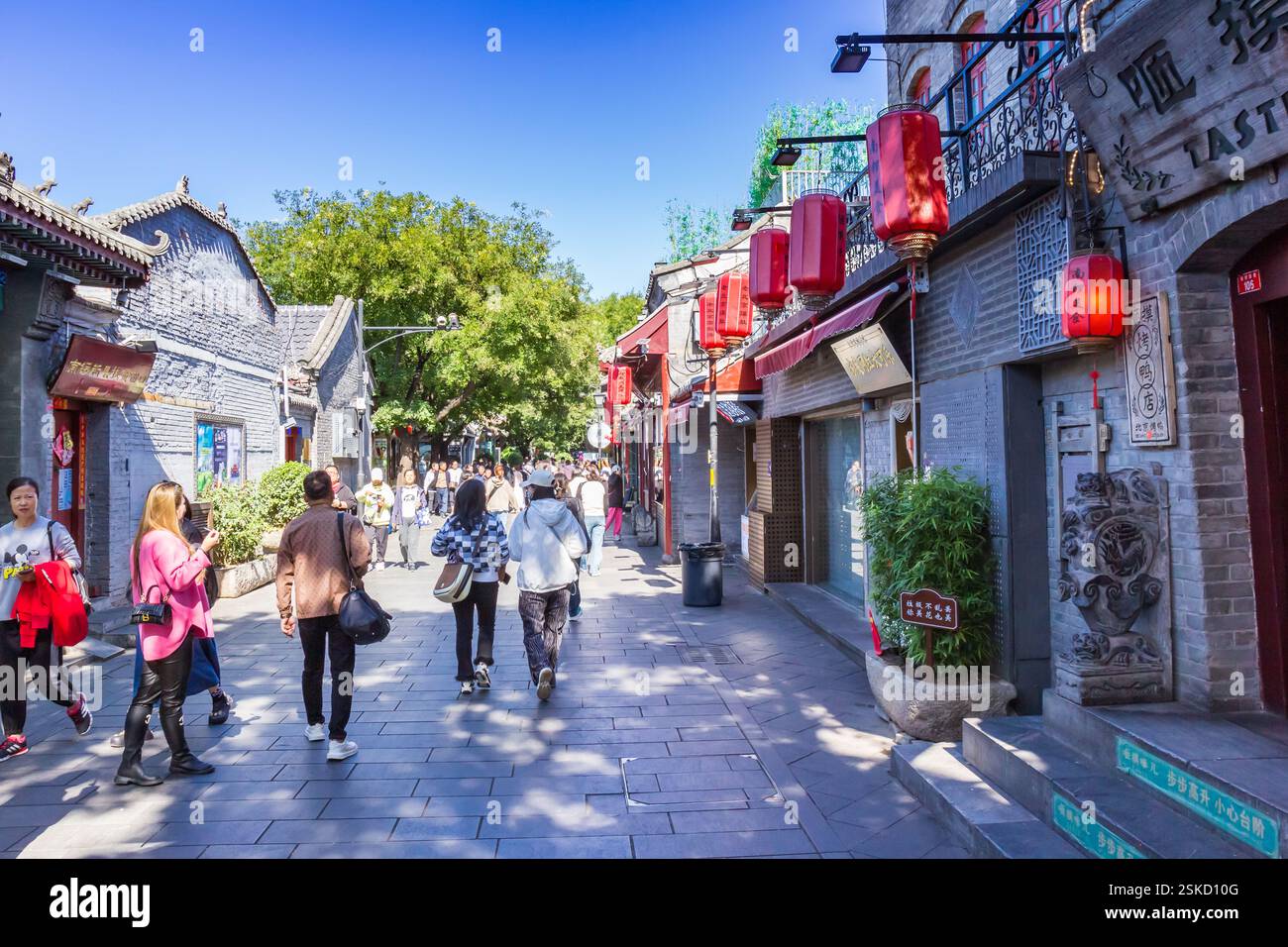 People walking the narrow streets of the hutongs in Beijing, China ...