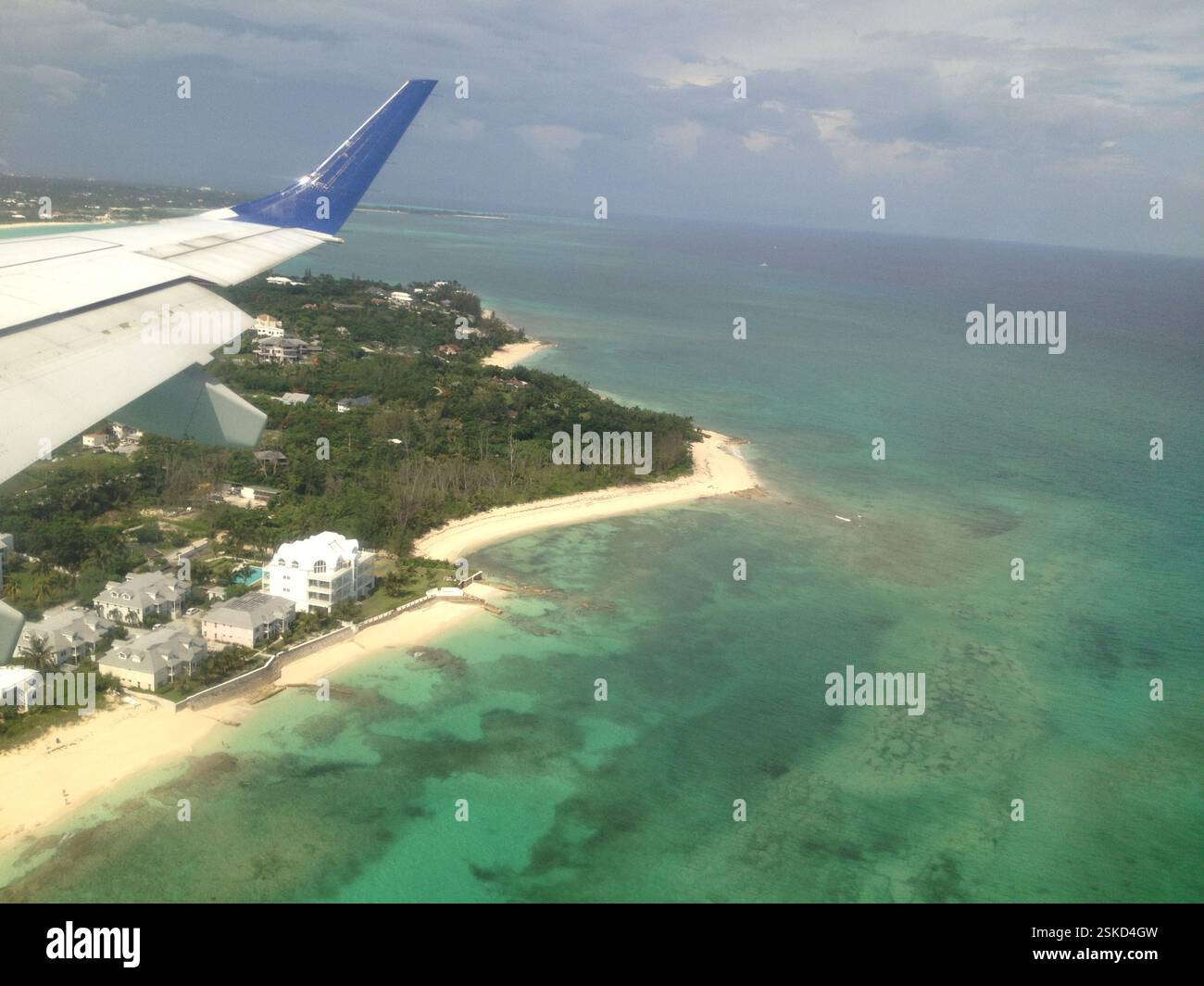 Aerial photo of Nassau, Bahamas. Turquoise water laps against pristine ...