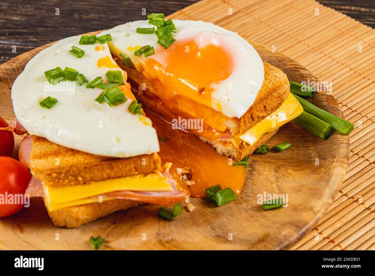 This hearty breakfast features a sandwich filled with melted cheese and ...