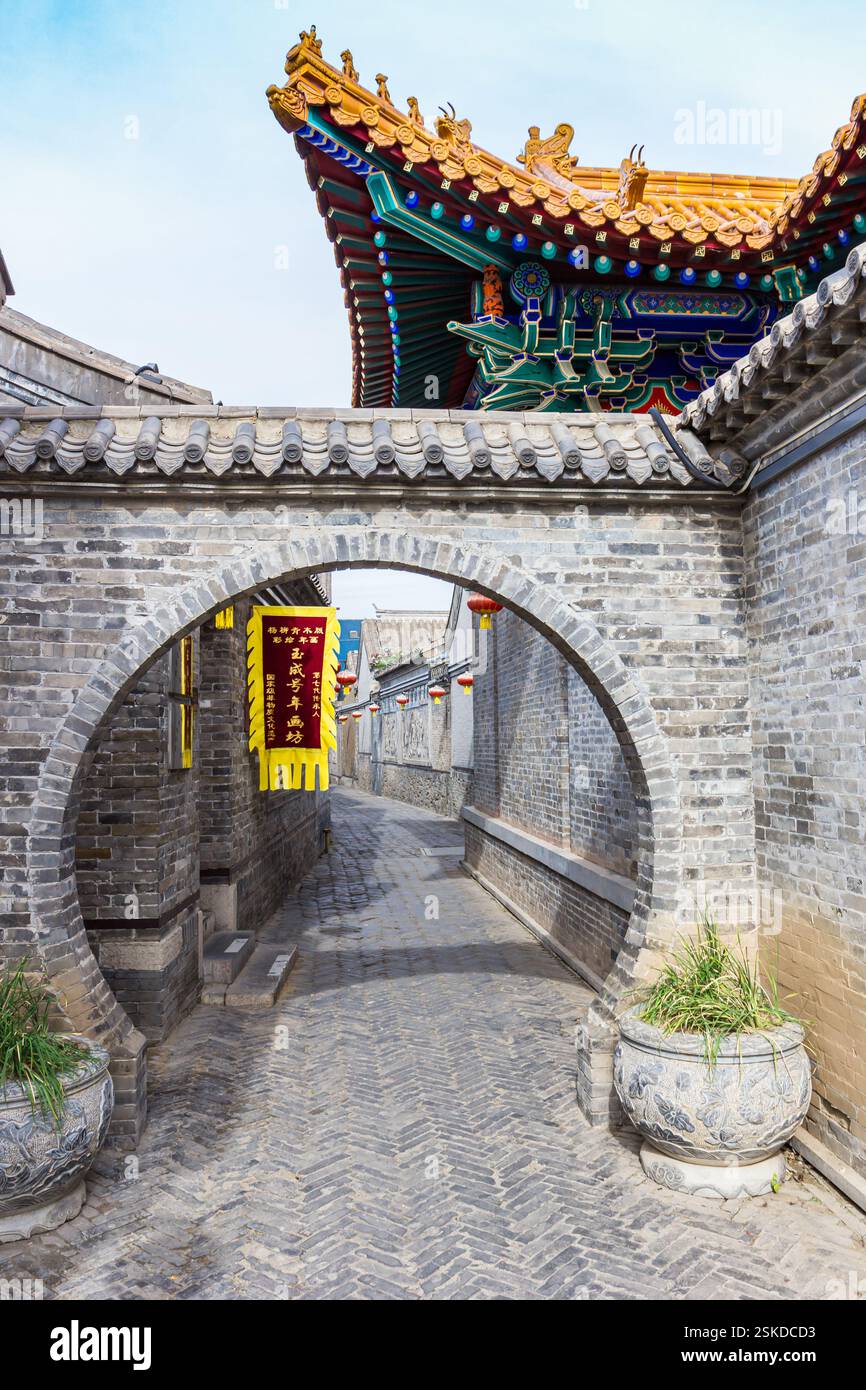 Traditional moon gate in a narrow street in Yangliuqing town in Tianjin ...