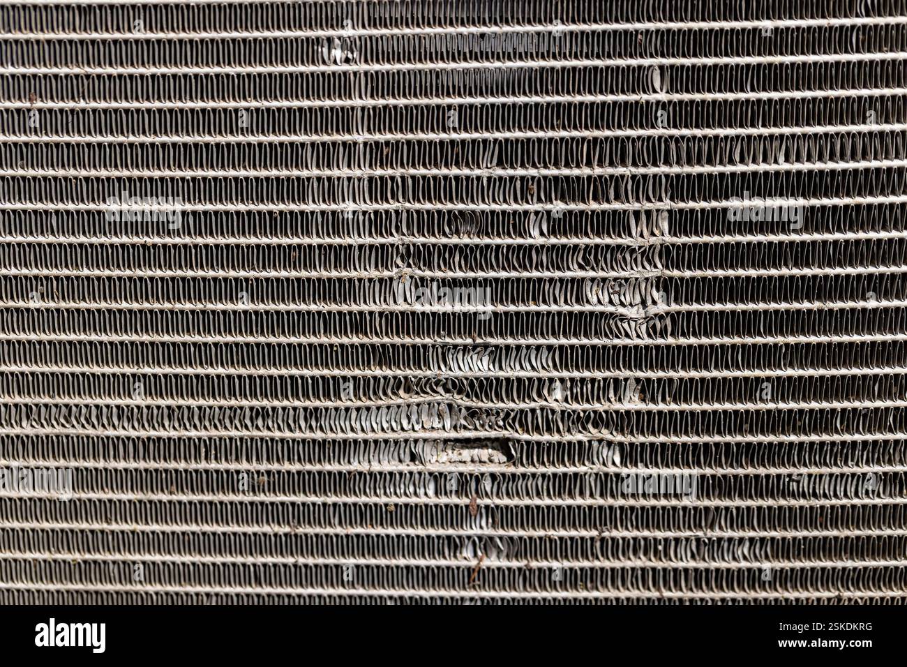 an car radiator damaged after an accident closeup, a radiator damaged ...