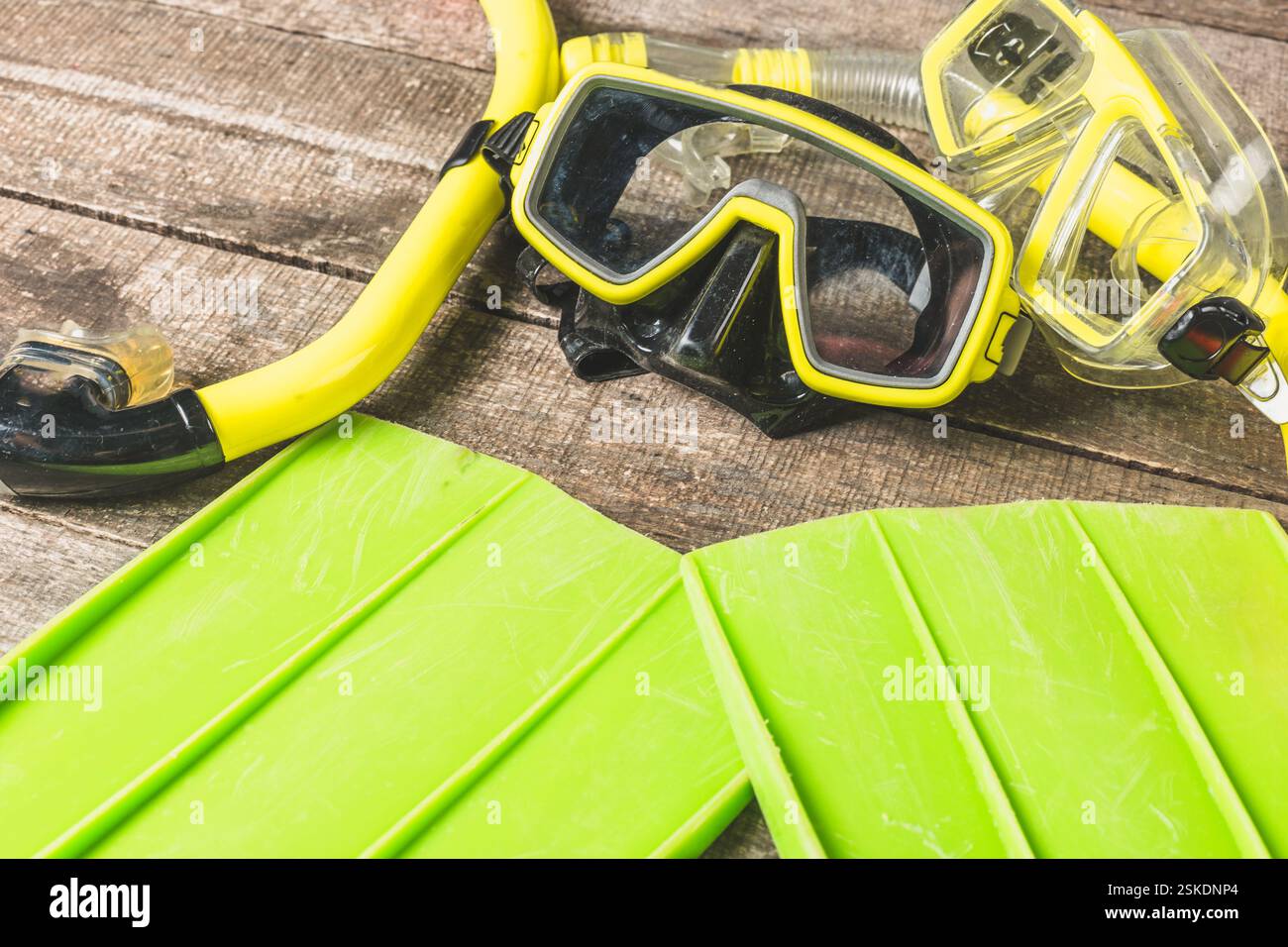 Diving equipment laid out on wooden surface, showcasing colorful ...