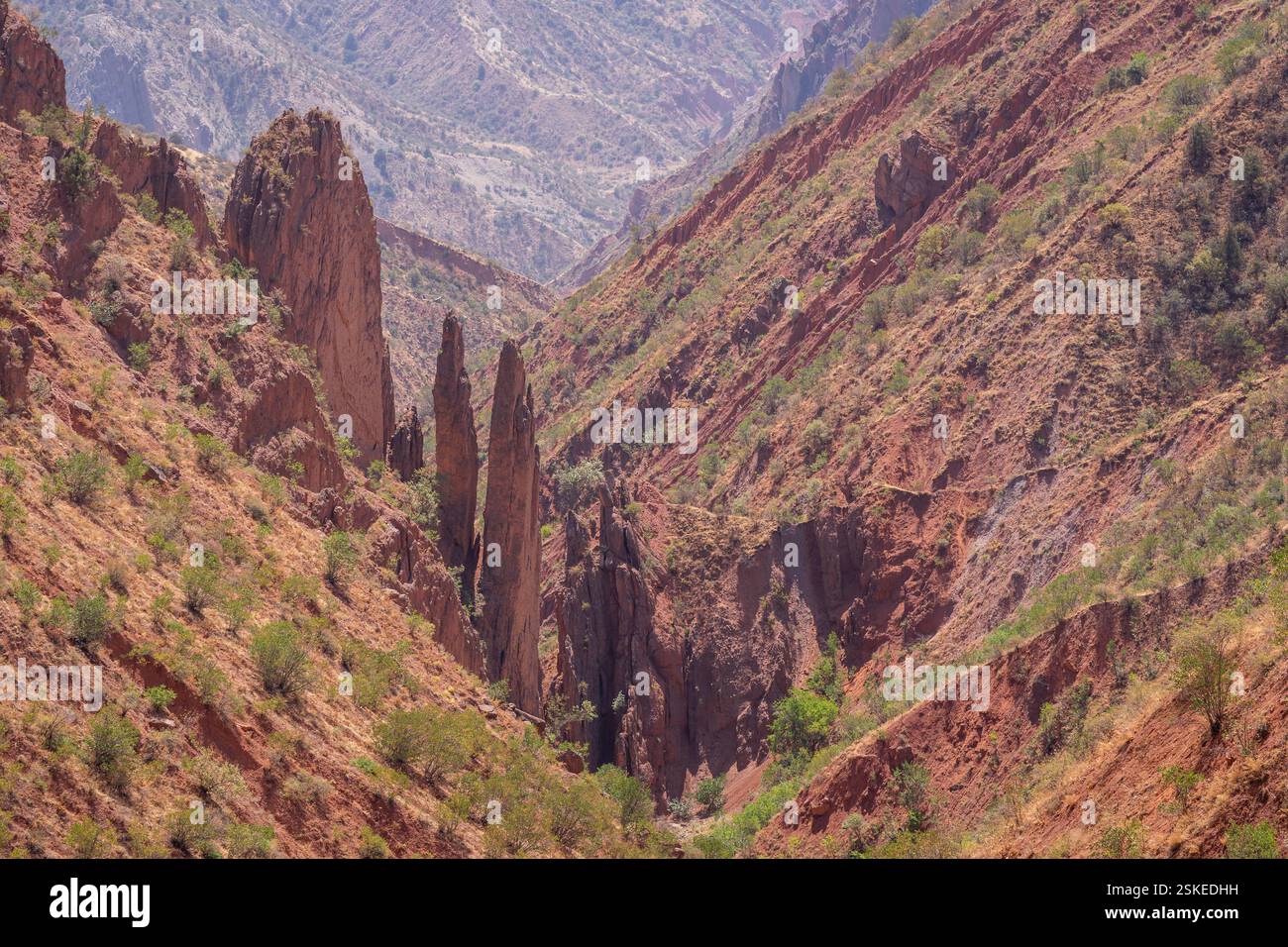 Scenic landscape view of spectacular vertical stone slabs in orange red ...