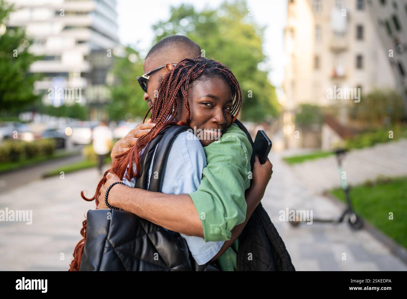 Sad African American couple hug goodbye, woman reluctant to let go on ...