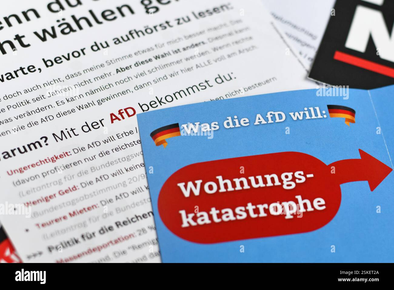 Germany - February 2025: Close up of various flyers informing about ...