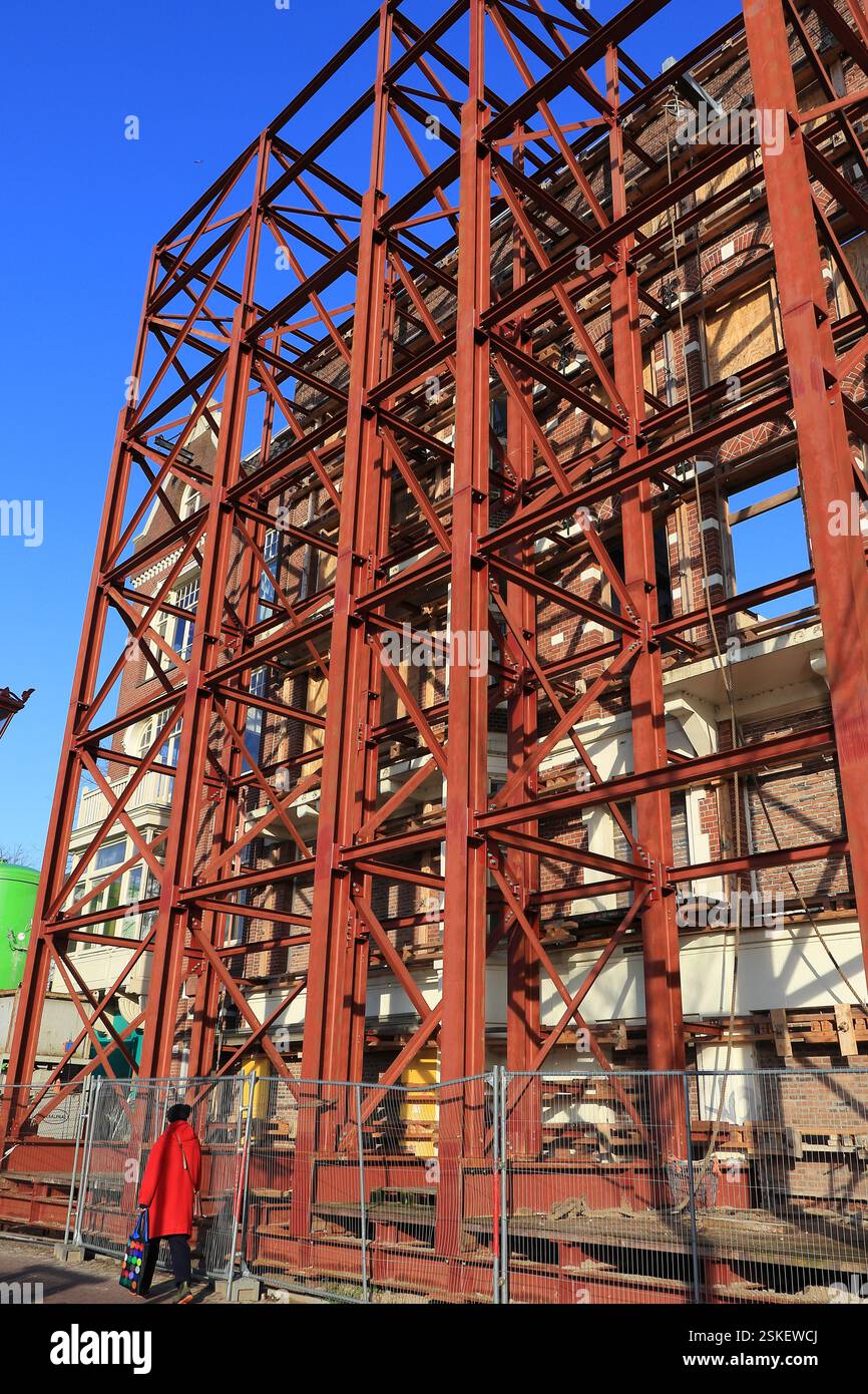 Historic house facade with metal support stucture during construction ...