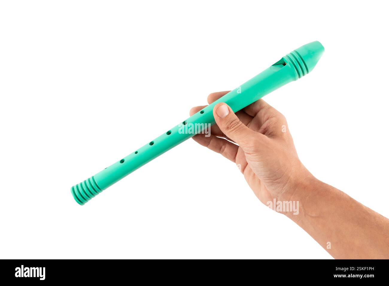 Male hand holding a green recorder flute isolated on white background ...