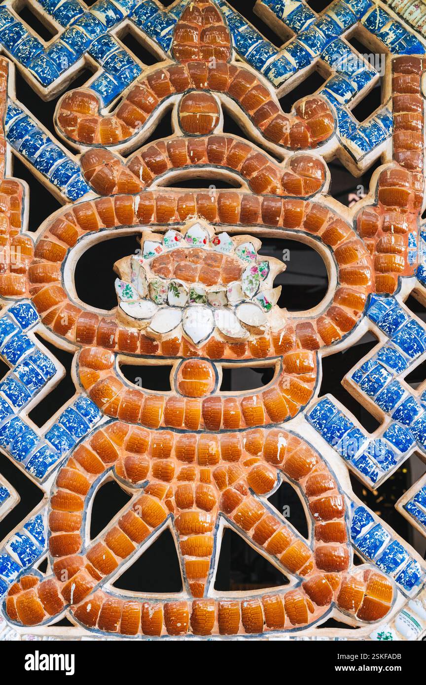 a pattern and a lotus flower made of small ceramic tiles Stock Photo ...