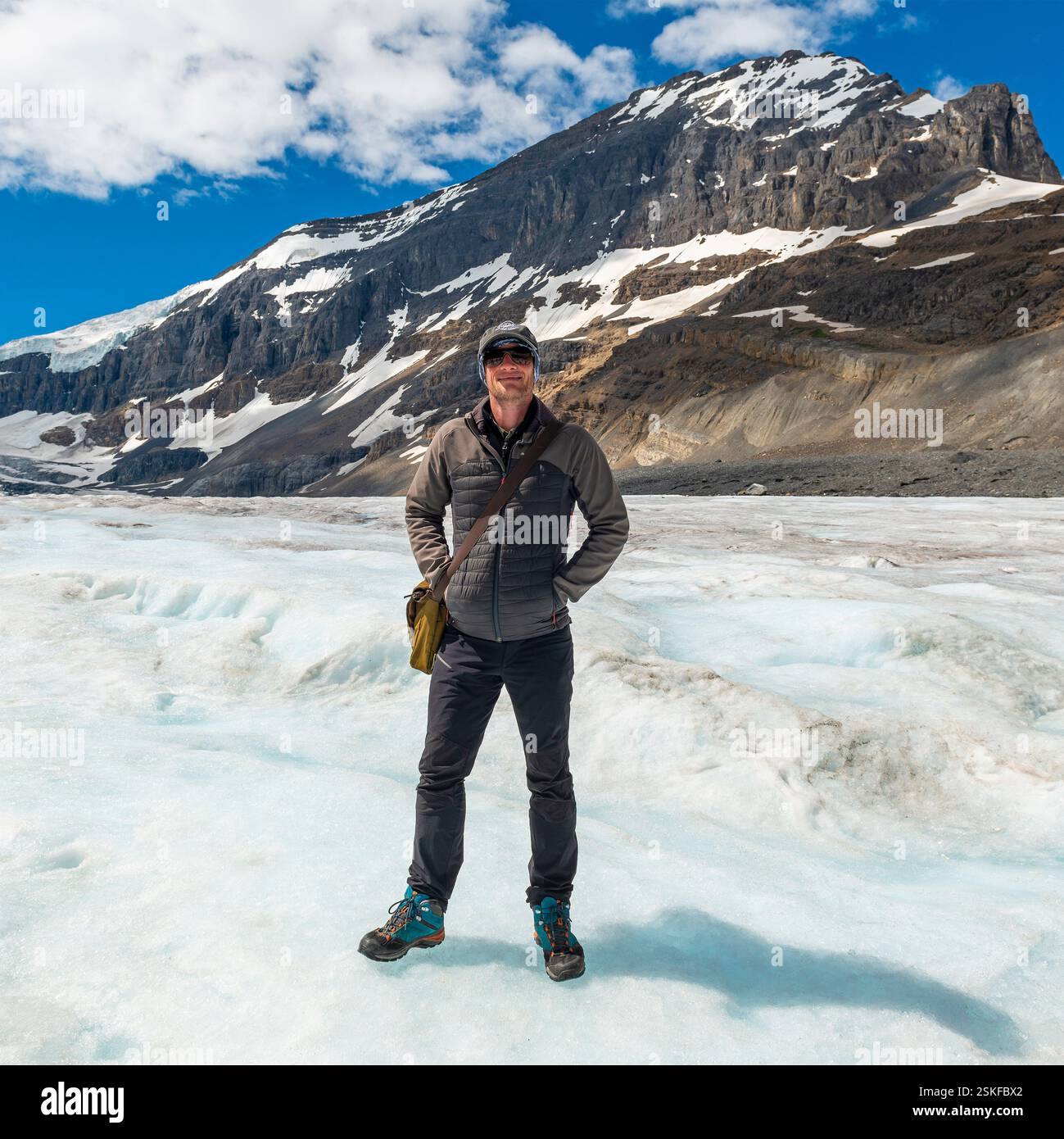 Tourist on Athabasca Glacier ice walk hike, Jasper national park ...