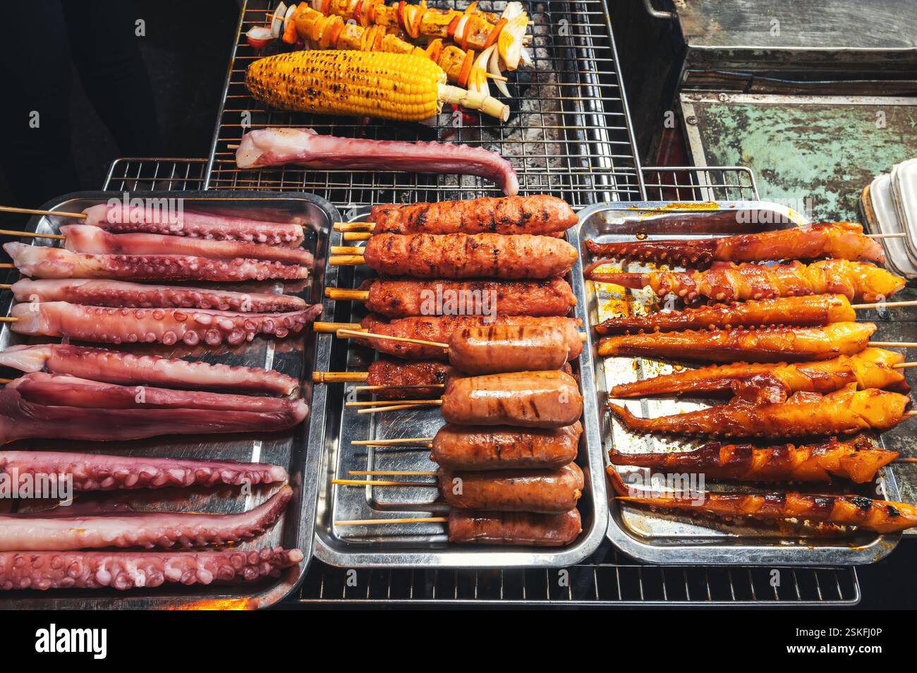 Fish and meat mix barbecue close up in South East Asian food market ...