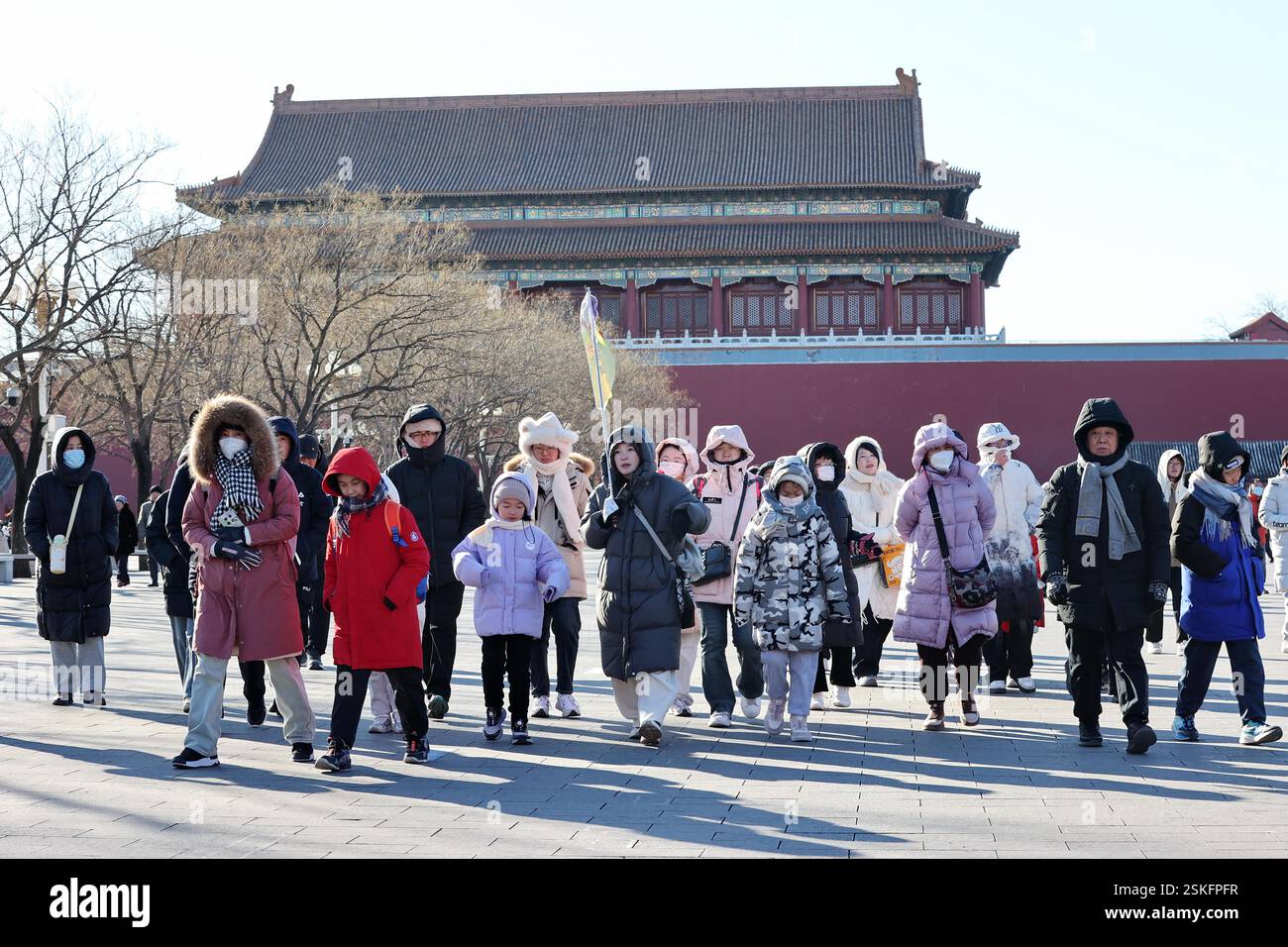 Tourists visit the Palace Museum amid cold air in Beijing, China, 8 ...
