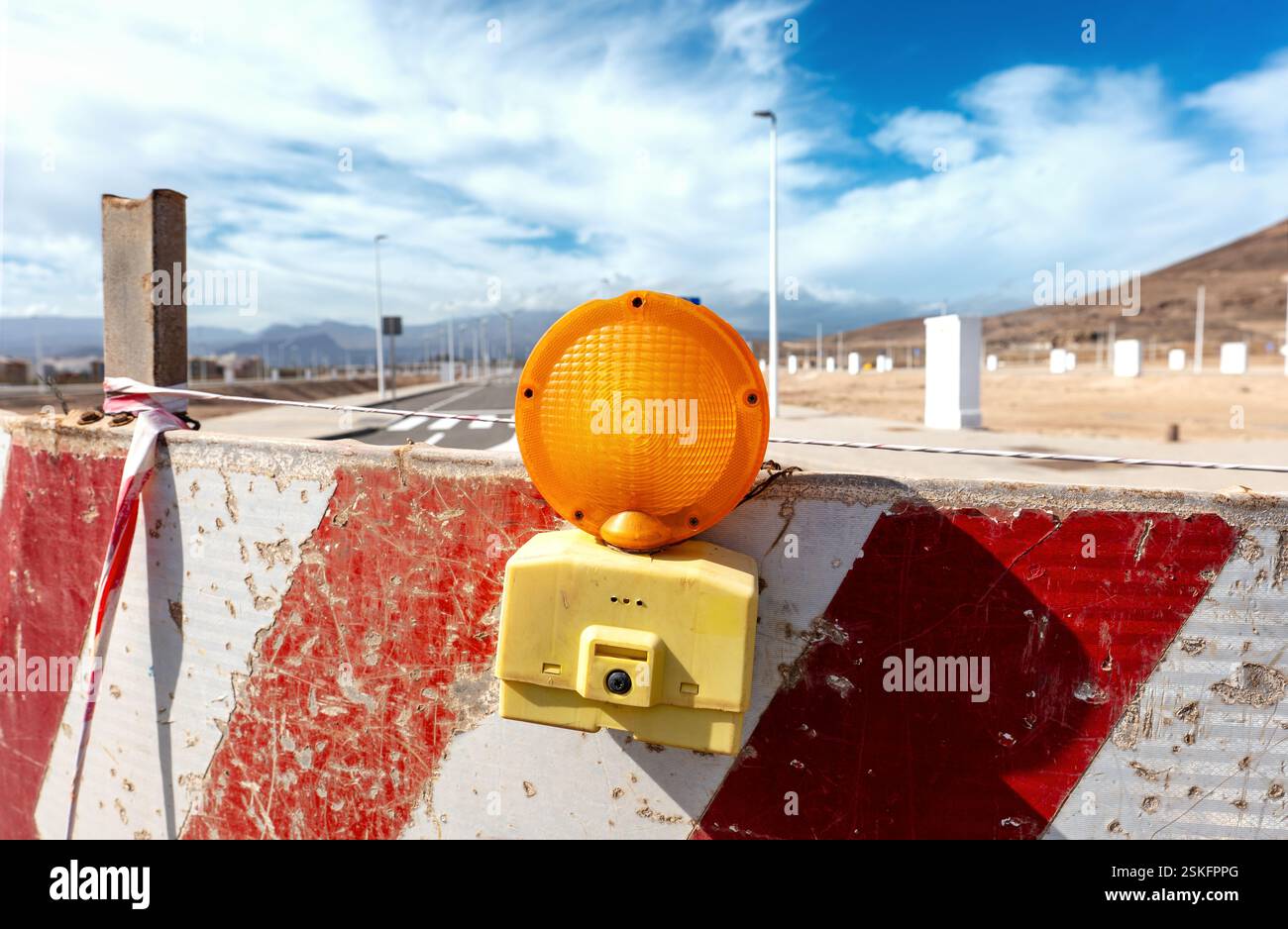 Orange safety lamp on a roadblock at a major construction site Stock ...