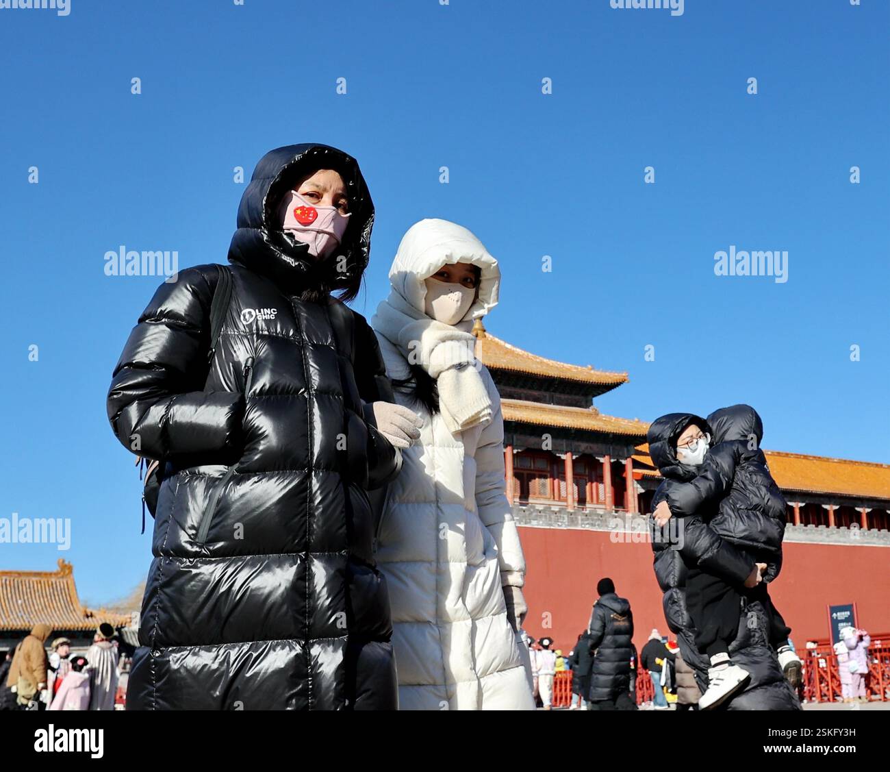 Tourists visit the Palace Museum amid cold air in Beijing, China, 8 ...