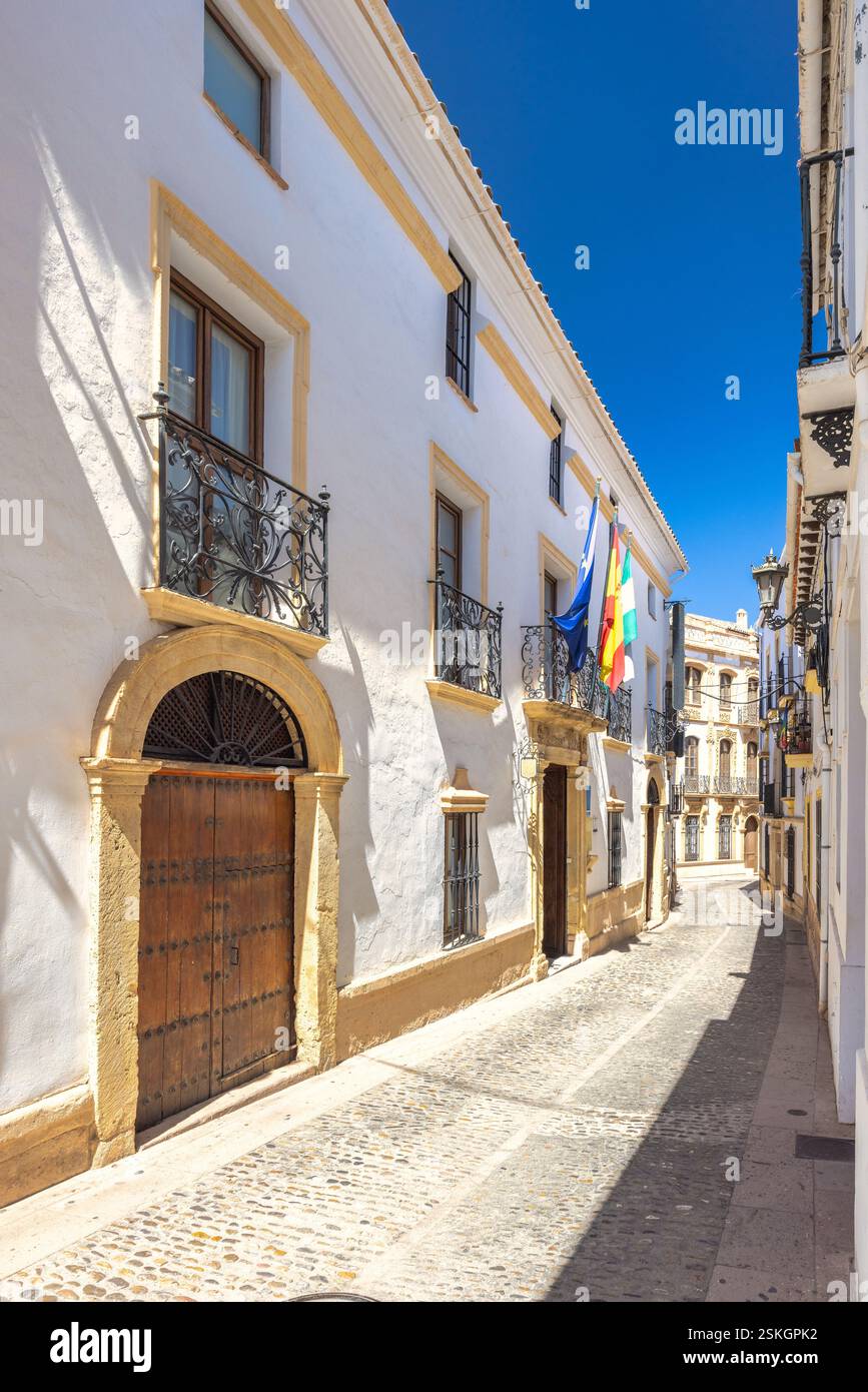 Ronda town in Spain. Sun-drenched cobblestone street in a historic town ...
