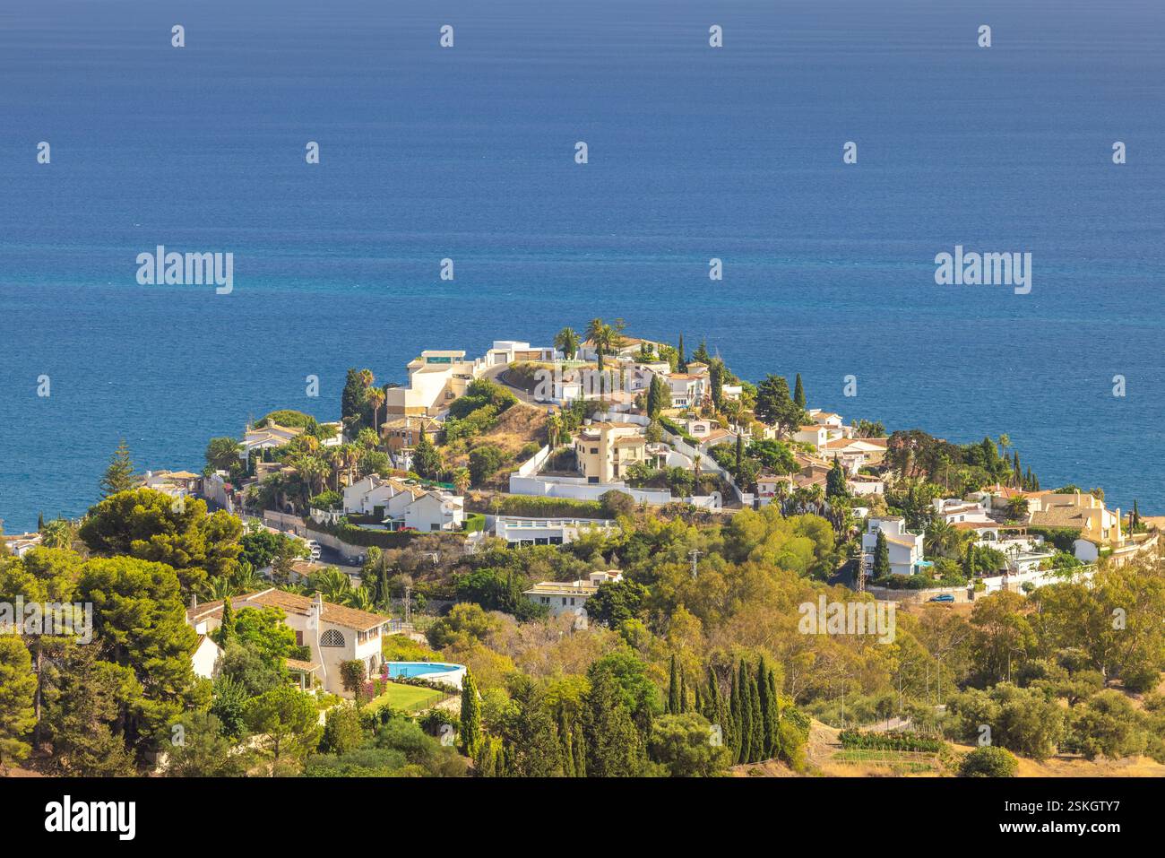 Coastal hillside homes overlooking the ocean. Luxury villas nestled ...