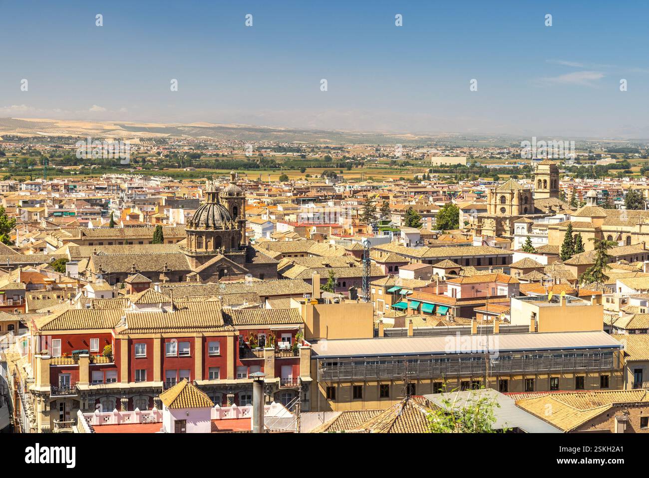 A scenic cityscape features rooftops and architectural landmarks ...