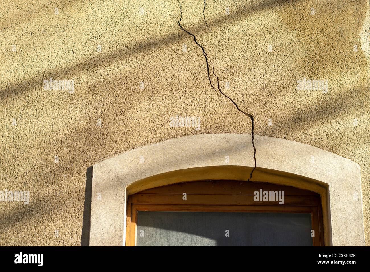 Crack in a wall on the window on the house construction defects Stock ...