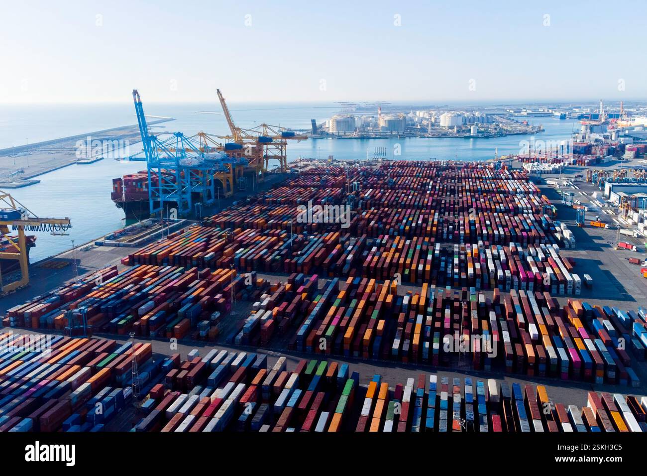 Aerial view of shipping containers and cargo ships in the sea port of ...