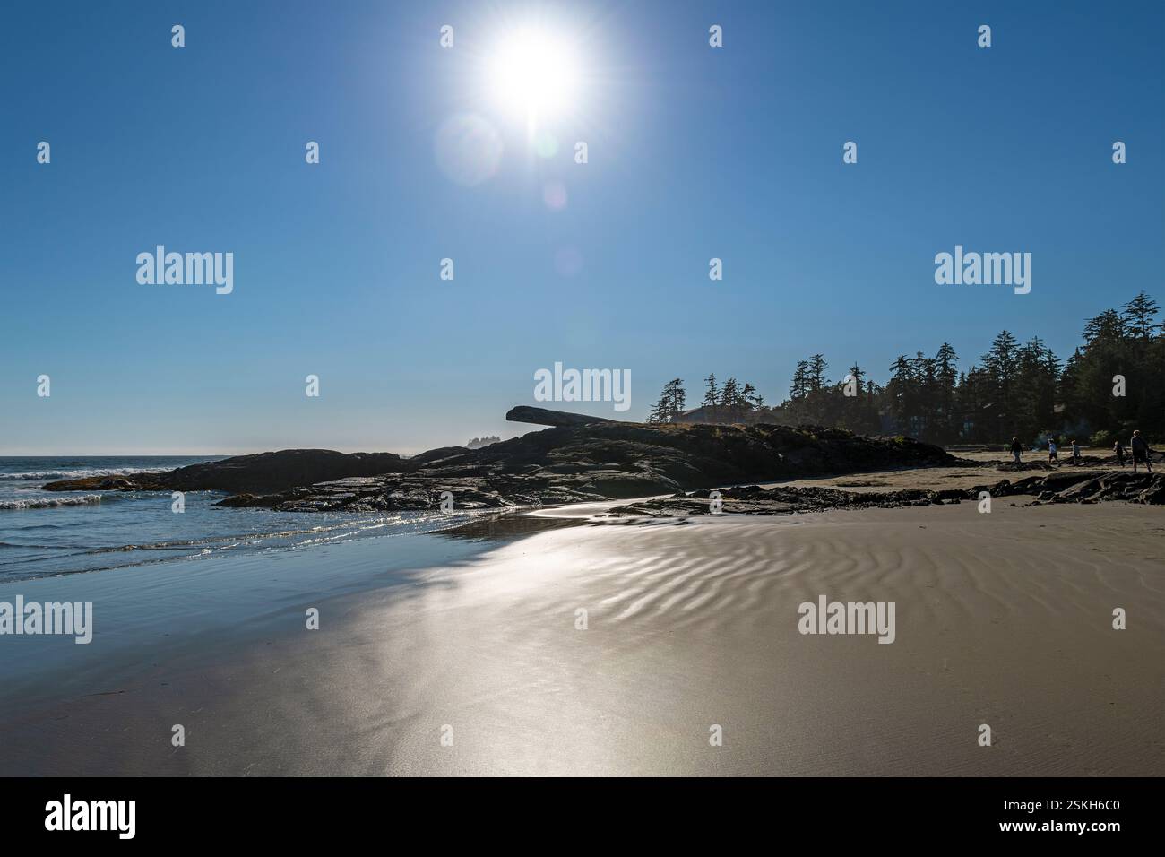 Chesterman beach with sun flare, Tofino, Vancouver Island, British ...
