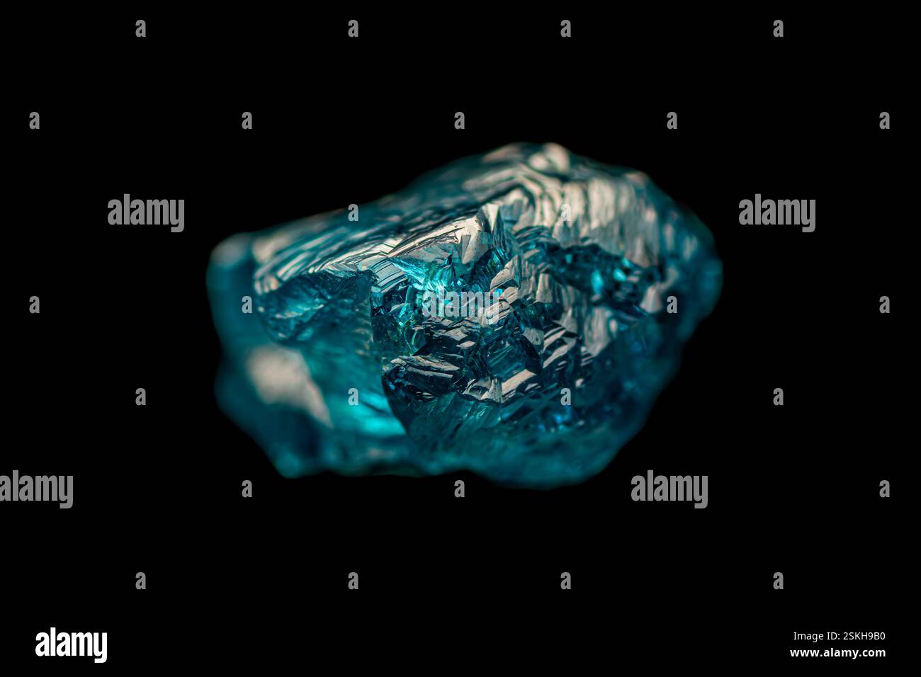Natural rough blue diamond on dark background Stock Photo - Alamy