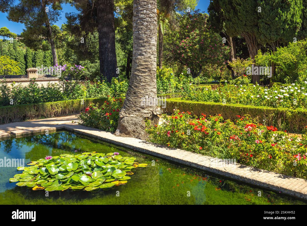 Alhambra complex in Granada town, Andalusia, Spain. Serene garden with ...