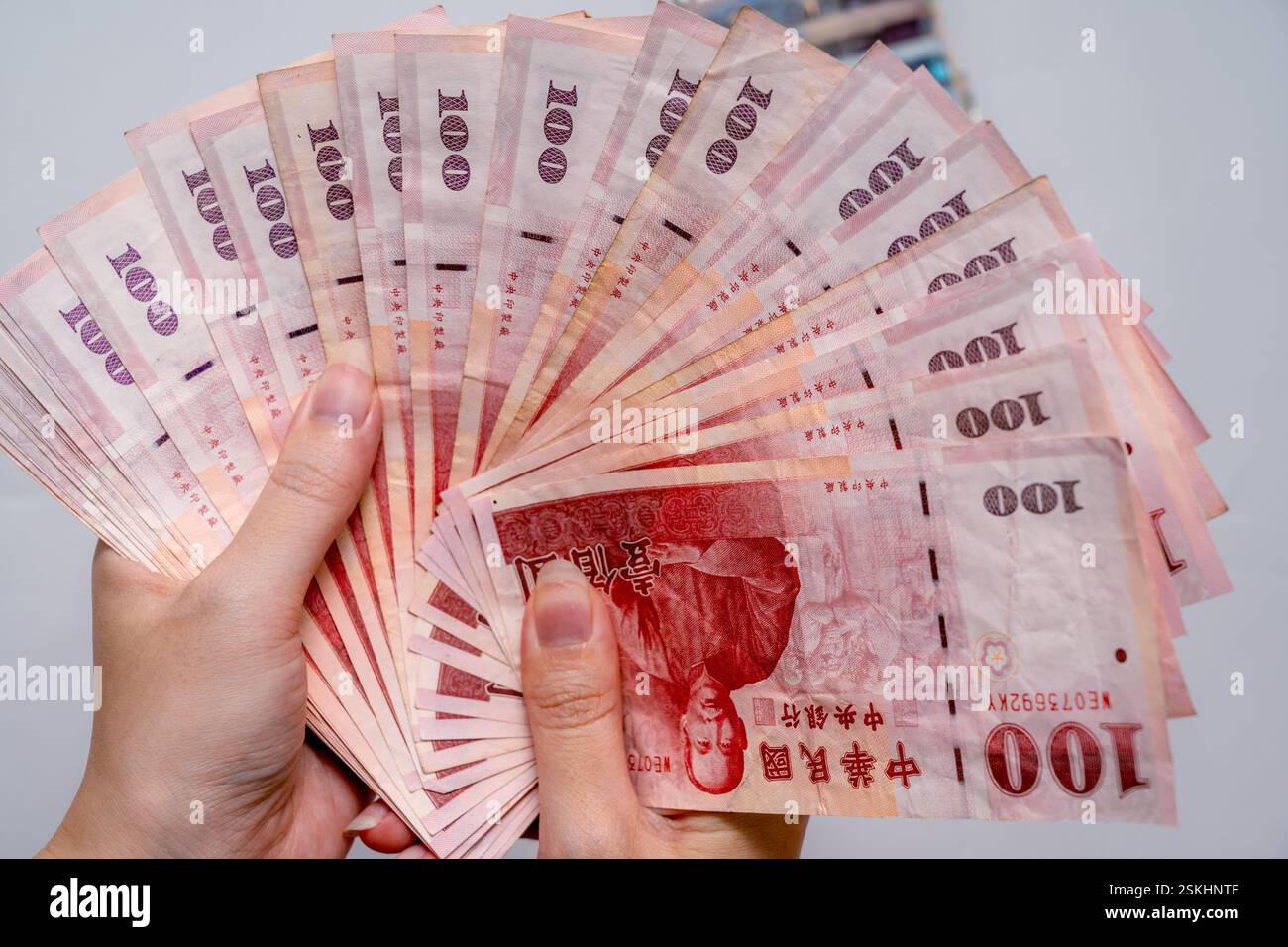 Holding New Taiwan Dollar, Taiwan banknote, symbol of wealth and ...