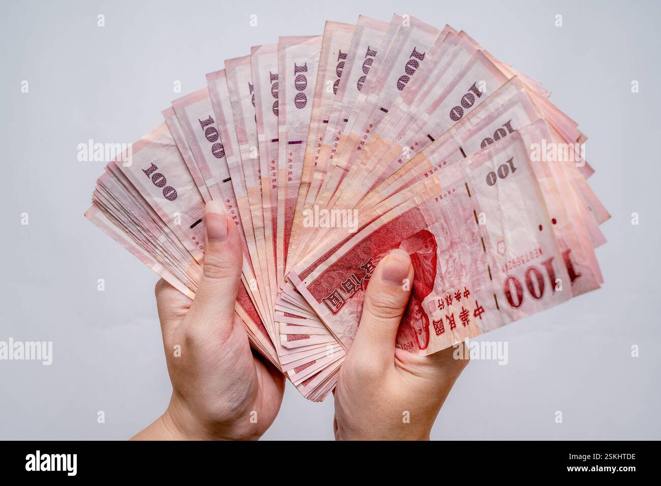 Holding New Taiwan Dollar, Taiwan banknote, symbol of wealth and ...