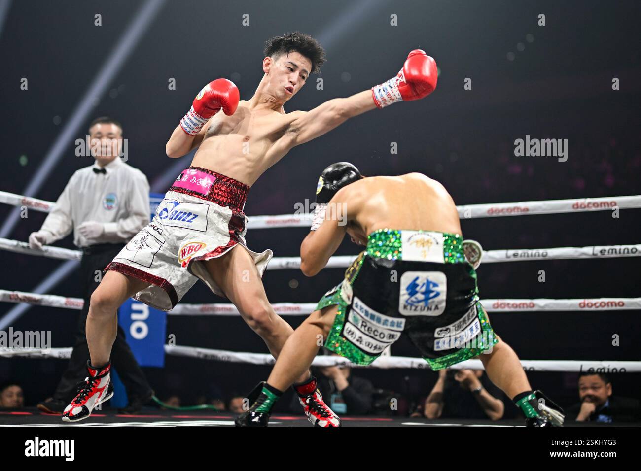 Tokyo, Japan. 24th Jan, 2025. Champion Goki Kobayashi (red gloves) throws a left at challenger ...