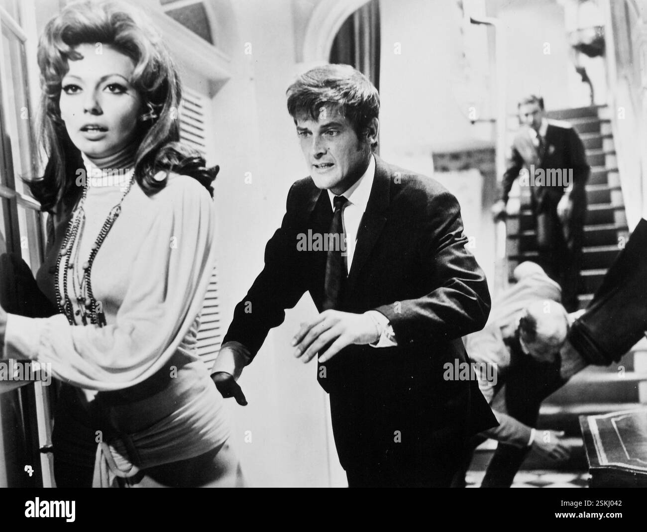 Claudie Lange, Roger Moore in "Crossplot" 1969#Claudie Lange, Roger ...