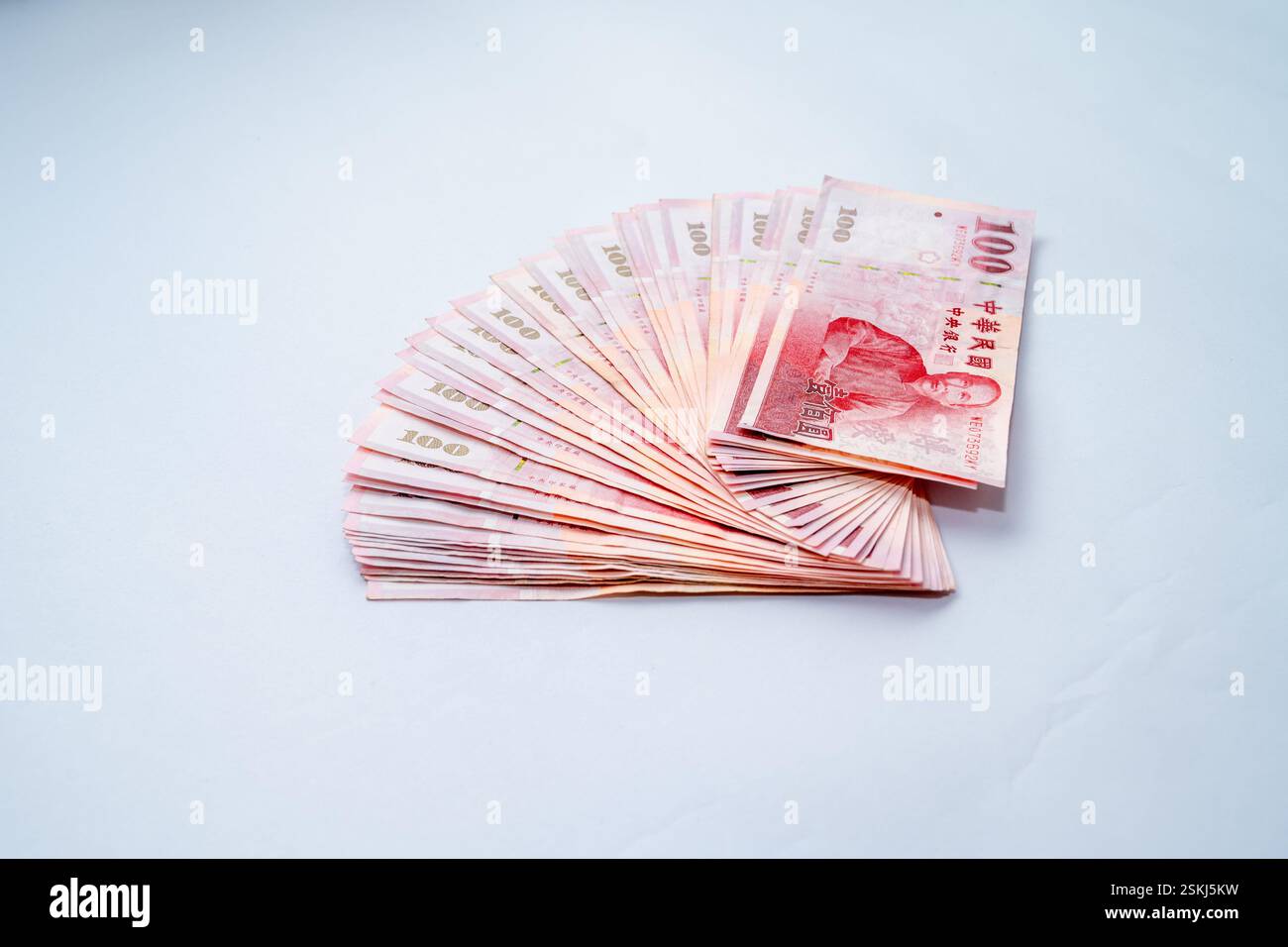 Large Stack of New Taiwan Dollar 100 Banknotes, Symbolizing Financial ...