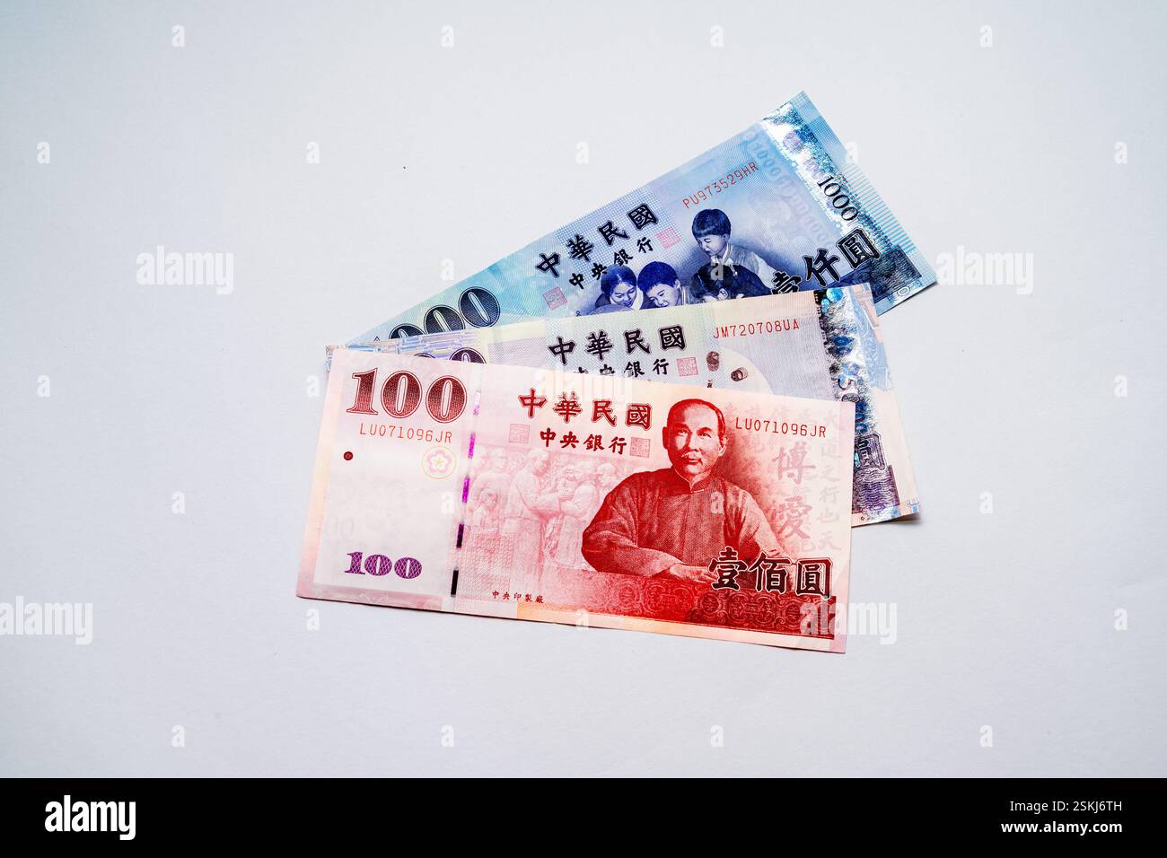 A Large Spread Of New Taiwan Dollar Banknotes Representing Wealth And
